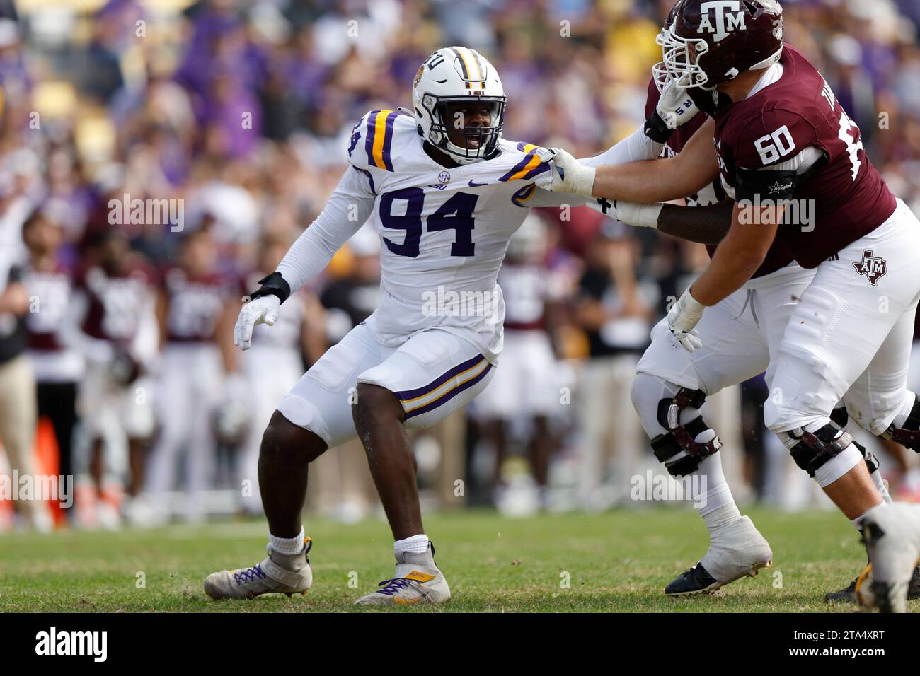 LSU defensive end Paris Shand (94) rushes against Trey Zuhn III (60 ...