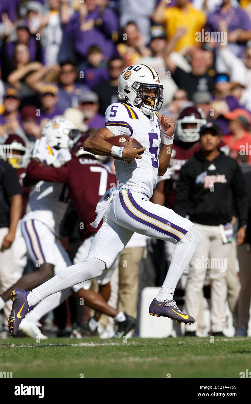 LSU quarterback Jayden Daniels (5) carries the ball on a run during an ...