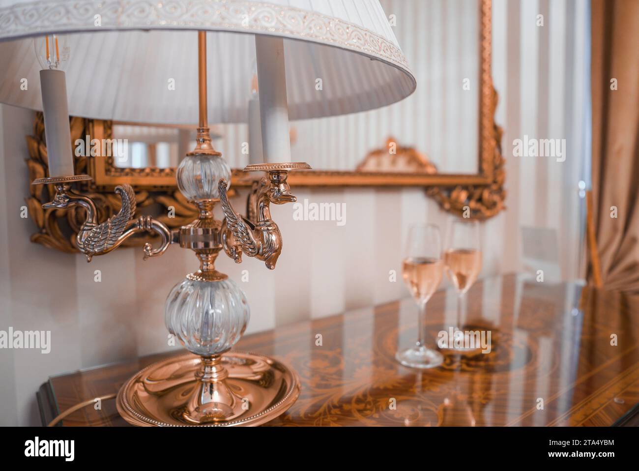 Intimate Table Setting with Wine Glasses and Lamp in Elegant Venetian ...