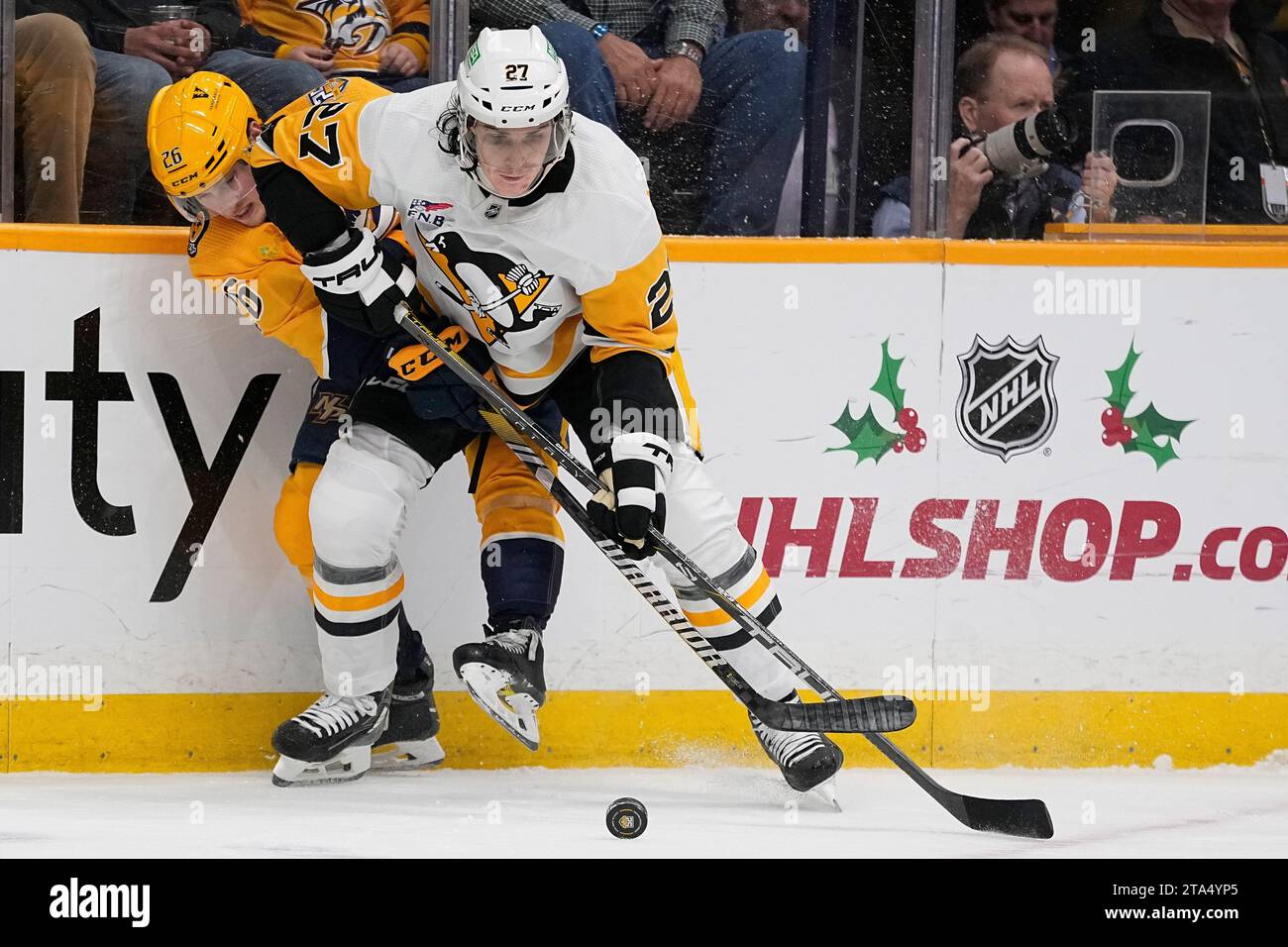 Pittsburgh Penguins defenseman Ryan Graves (27) takes the puck from ...