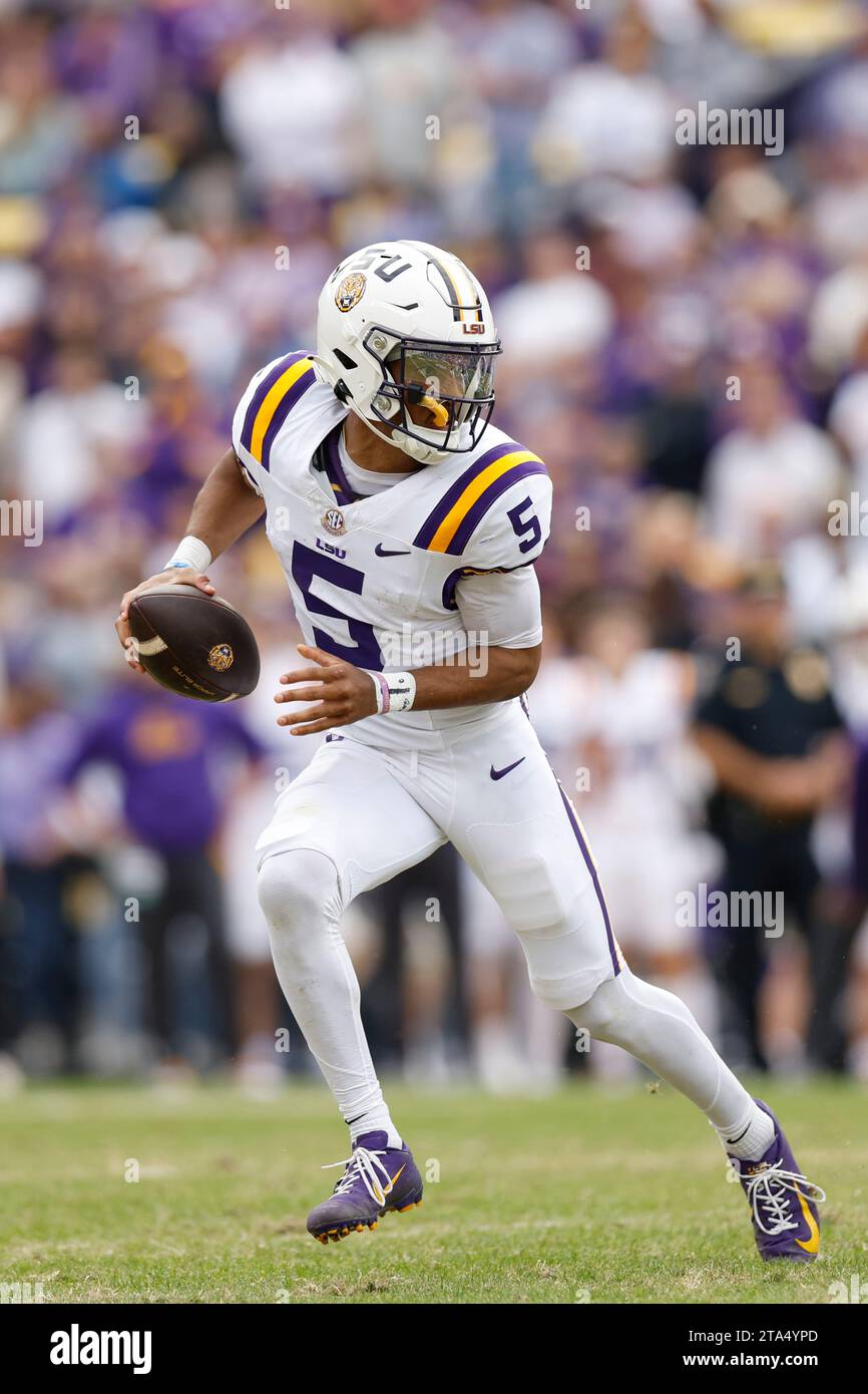 LSU quarterback Jayden Daniels (5) carries the ball during an NCAA ...