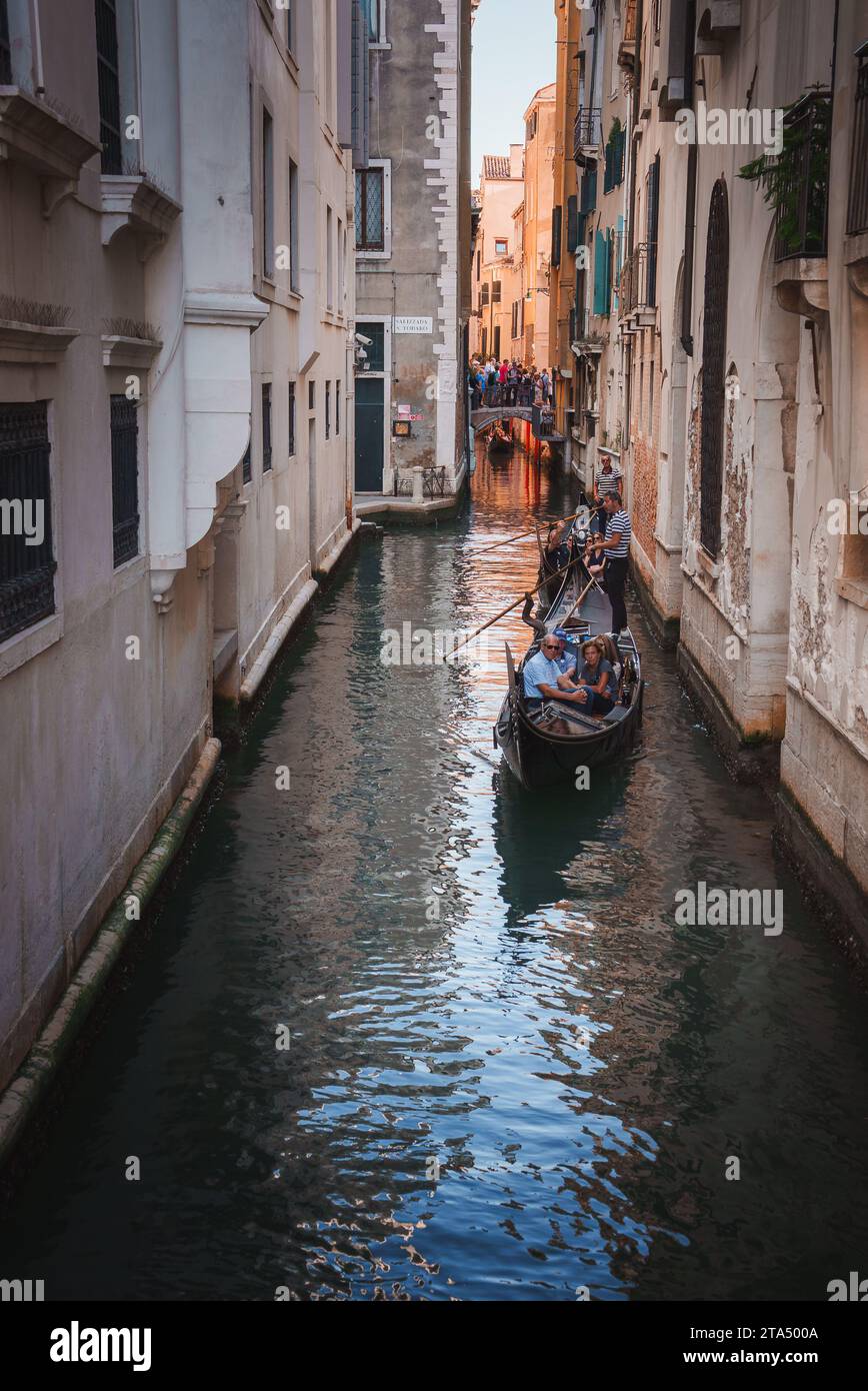 Tranquil gondola ride through narrow Venice canal with historic ...