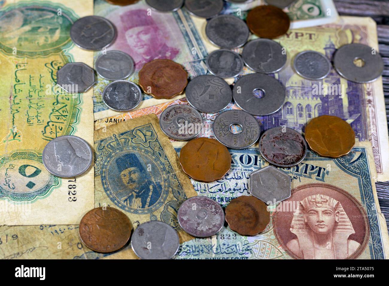 Selective focus of old Egyptian money banknote bills and coins of ...