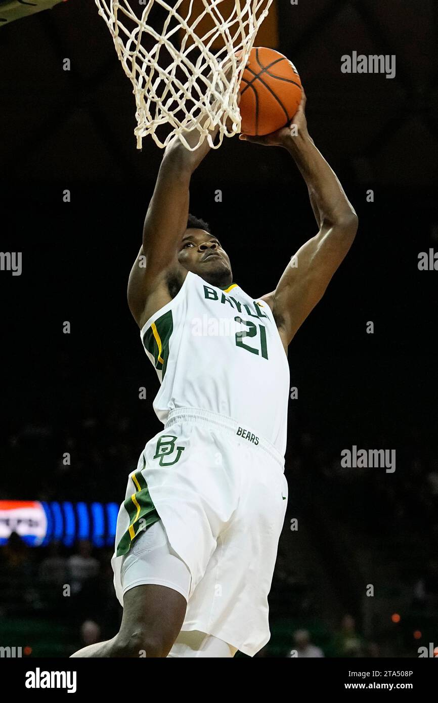 Baylor center Yves Missi (21) jumps to slam dunk during the first half ...