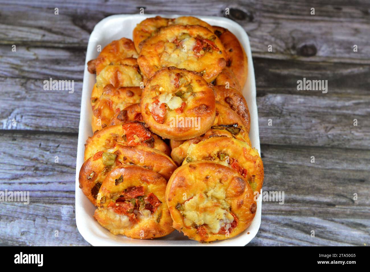 Pile of mini pizzas, Pizza is a dish of Italian origin consisting of a ...