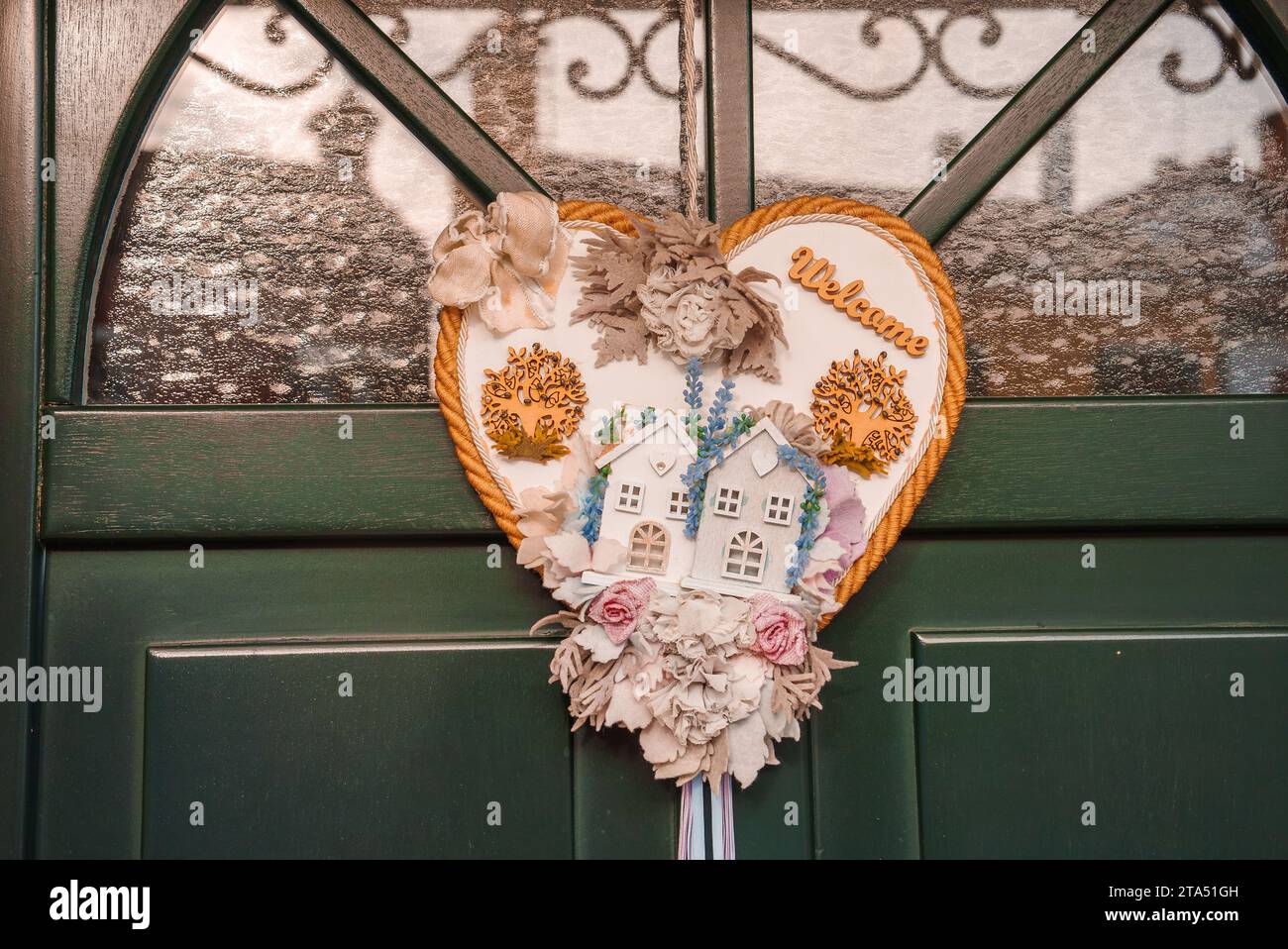 Beautiful Heart-Shaped Wreath Hanging on Green Door with Unknown ...