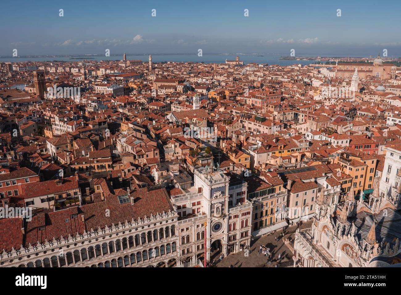 Aerial view of Venice, Italy showcasing red-roofed buildings, gondolas ...