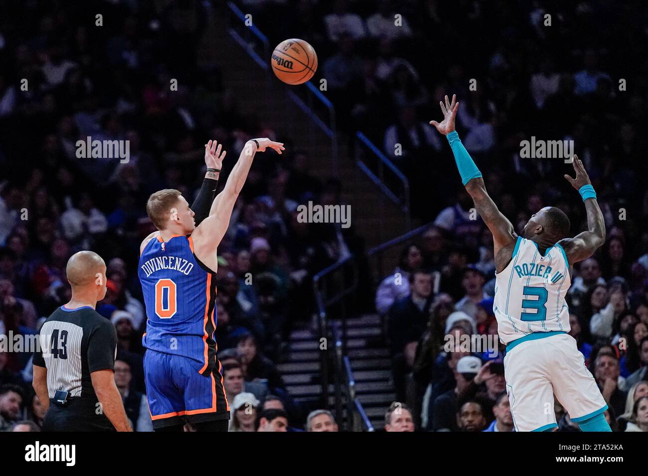 New York Knicks guard Donte DiVincenzo (0) shoots the ball over ...