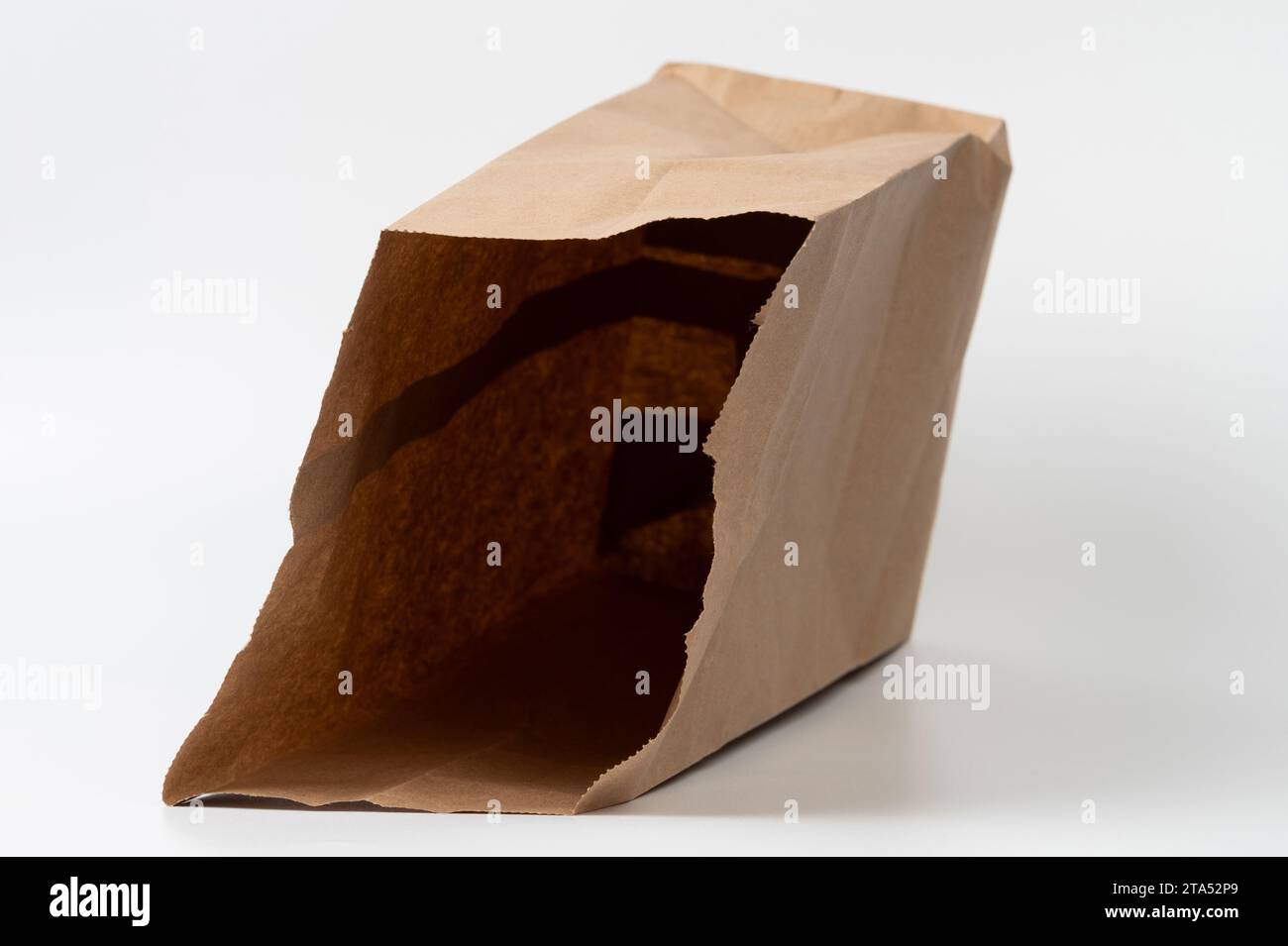 Open laying paper bag close up view isolated on white studio background ...