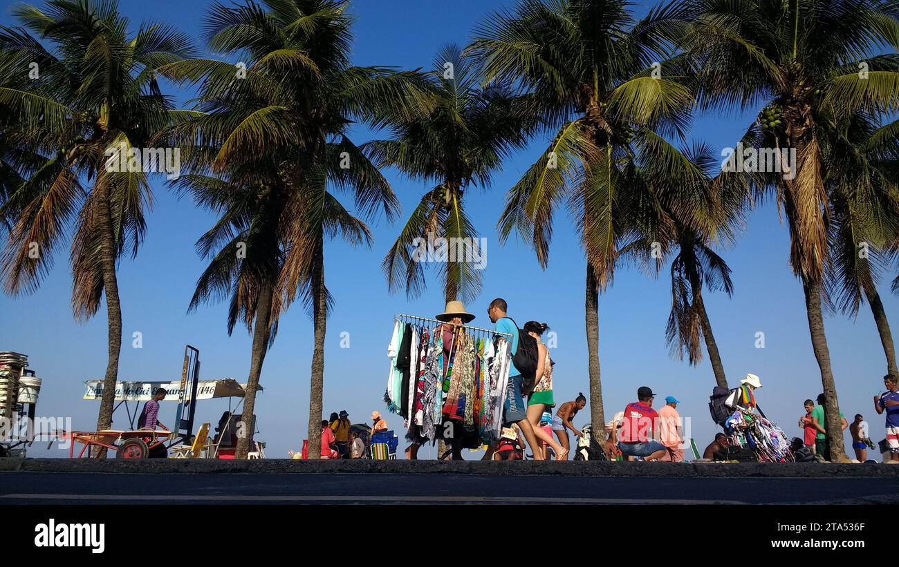 Street vendor sells coloful dresses at Copacabana beach promenade, Rio ...