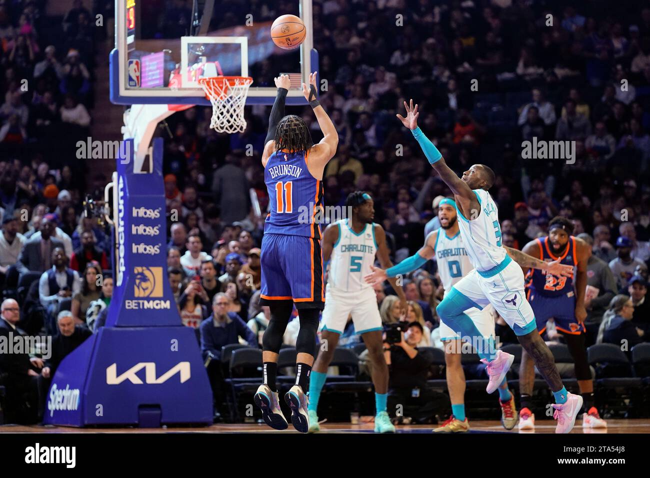 New York Knicks guard Jalen Brunson (11) shoots the ball over Charlotte Hornets guard Terry ...