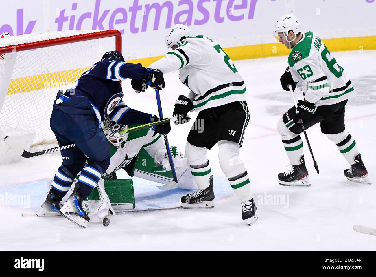 Dallas Stars goaltender Jake Oettinger (29) makes a save on Winnipeg ...