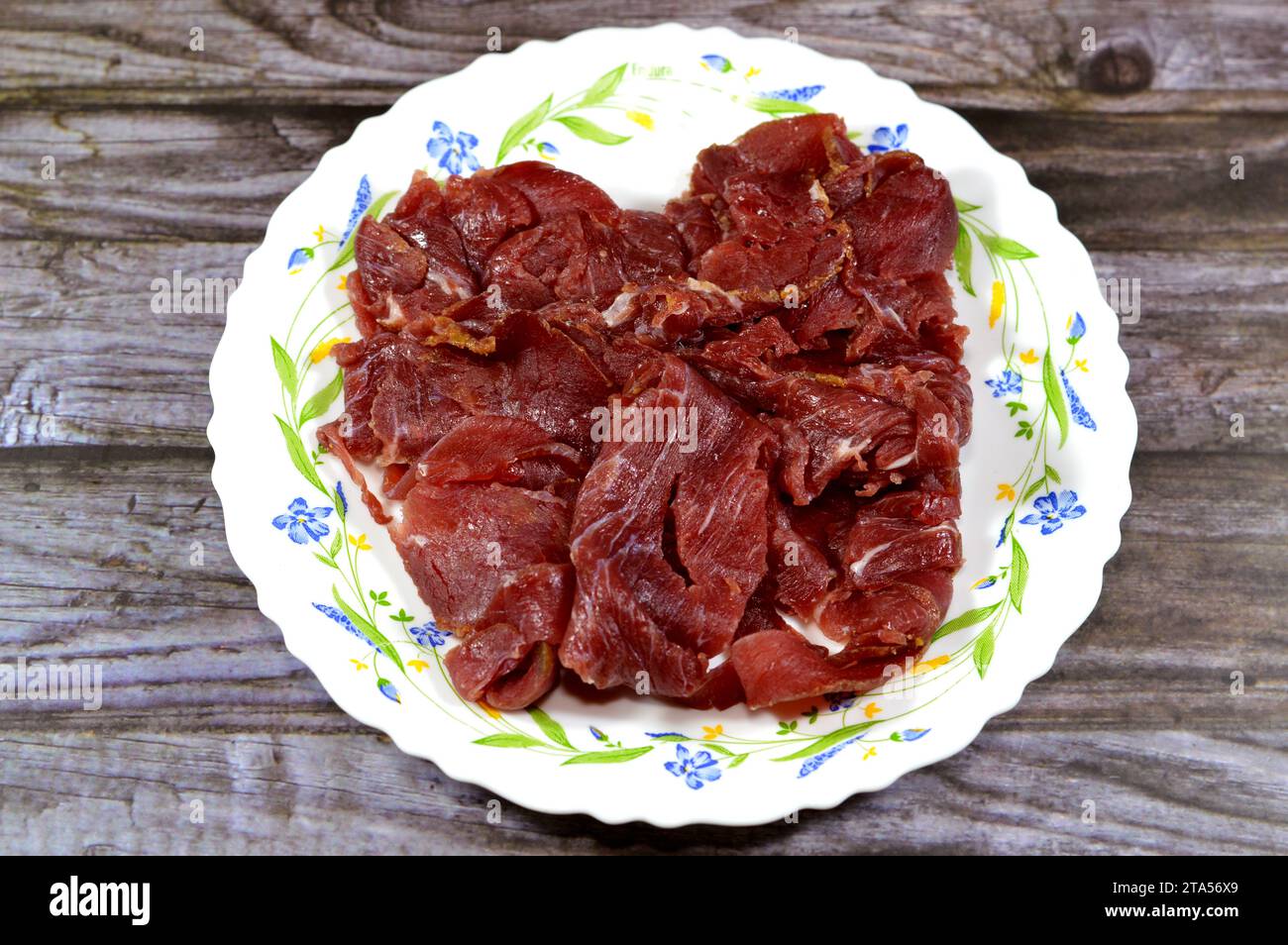 Thin slices of beef pastrami, made from beef brisket, raw meat is ...