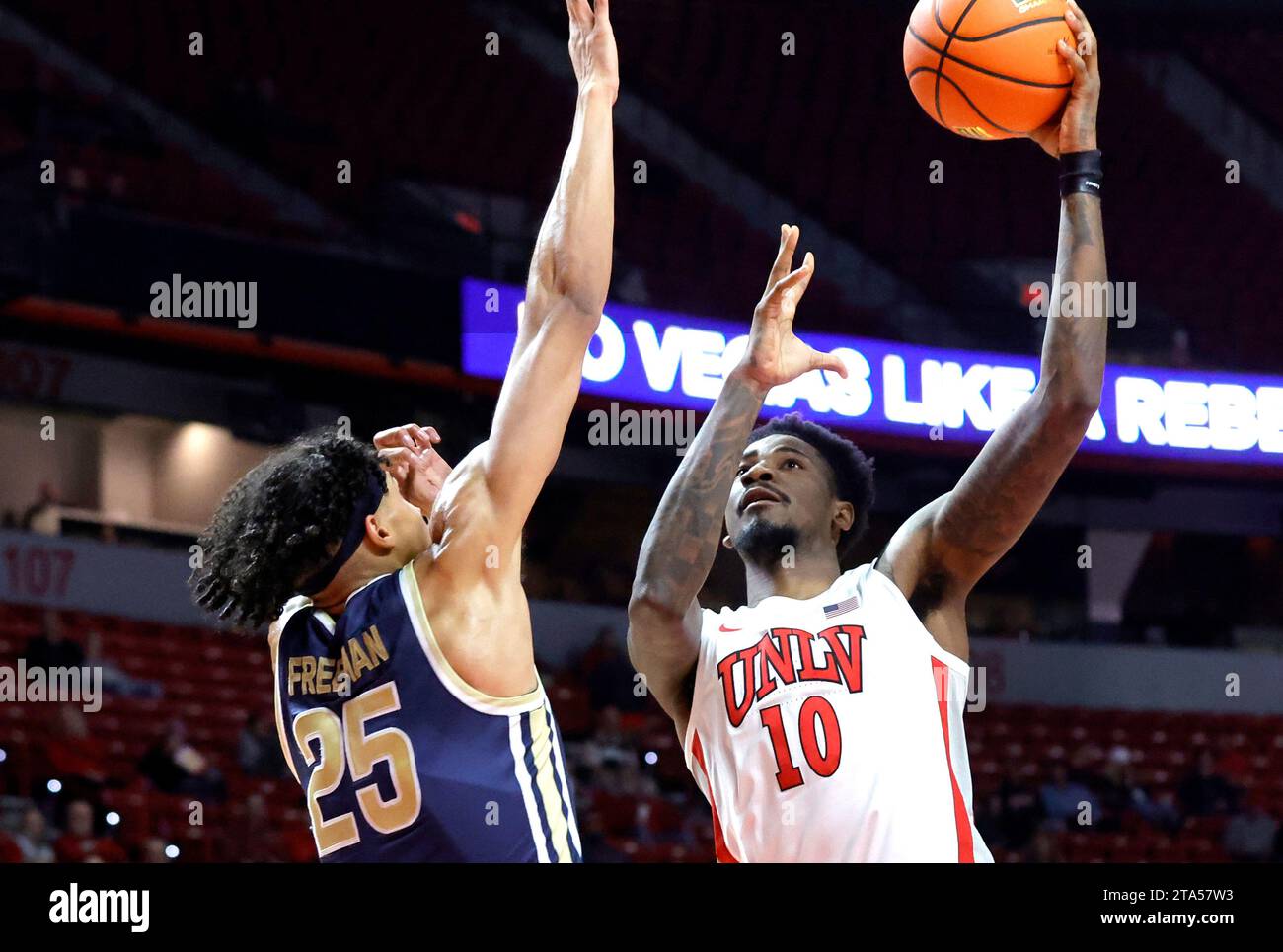 UNLV forward Kalib Boone (10) shoots over Akron forward Enrique Freeman ...