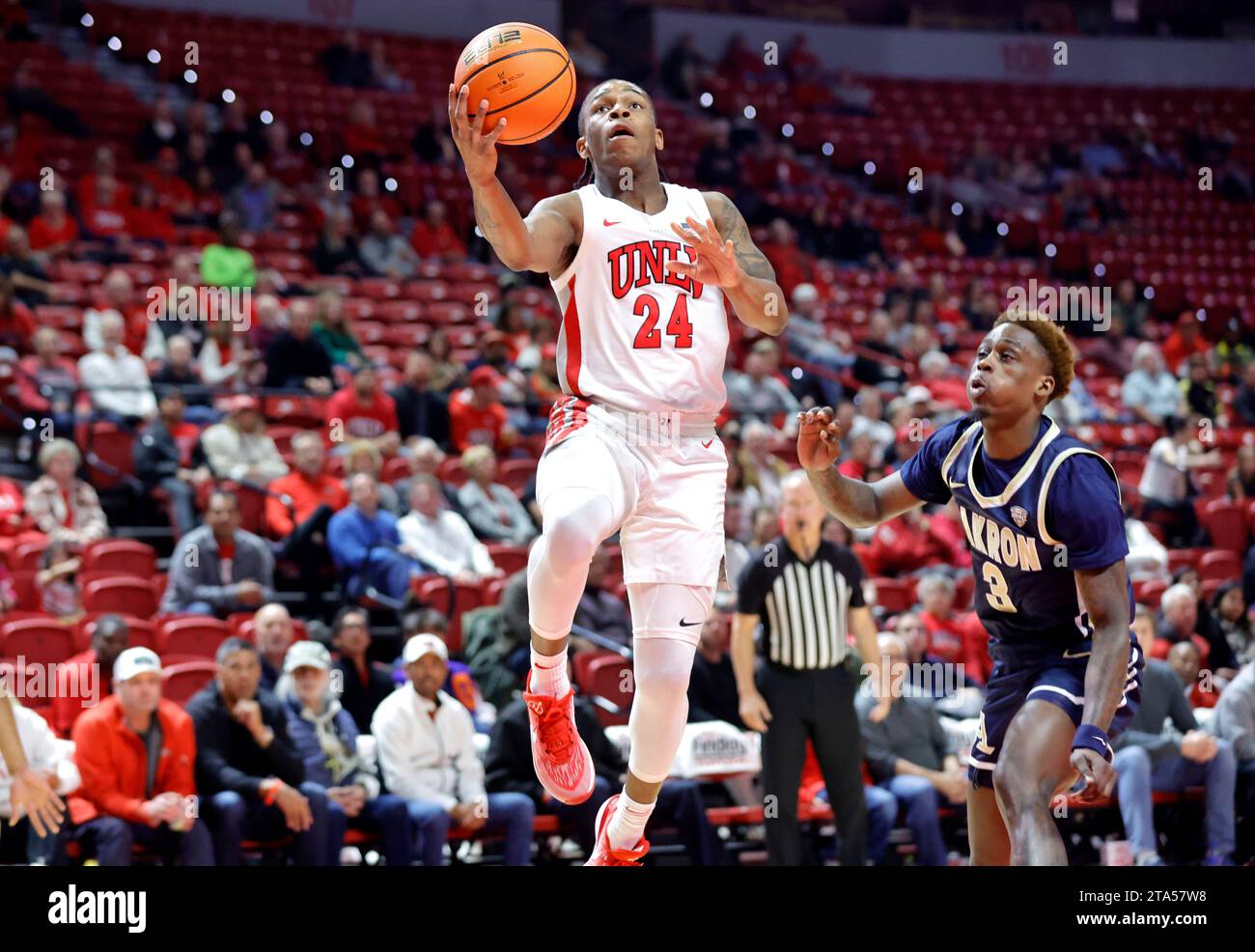 UNLV guard Jackie Johnson III (24) takes a shot ahead of Akron guard ...