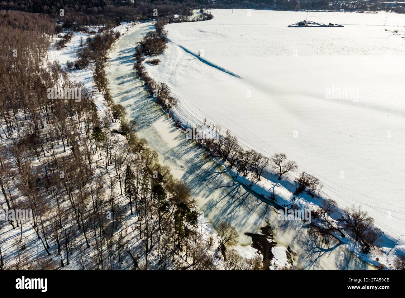 View from a high altitude of an icy river bed in the winter season ...