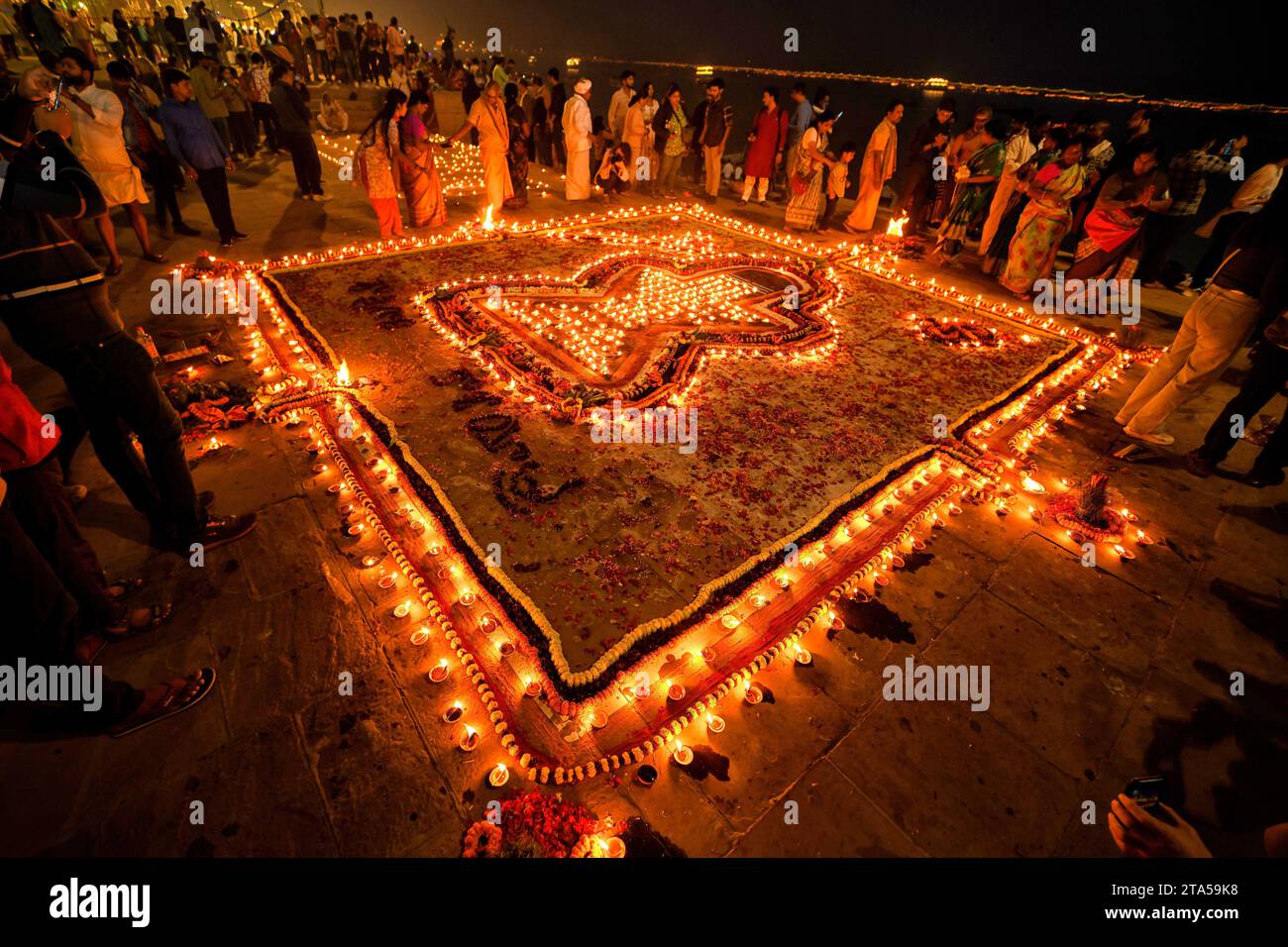 Hindu devotees light earthen lamps hi-res stock photography and images ...