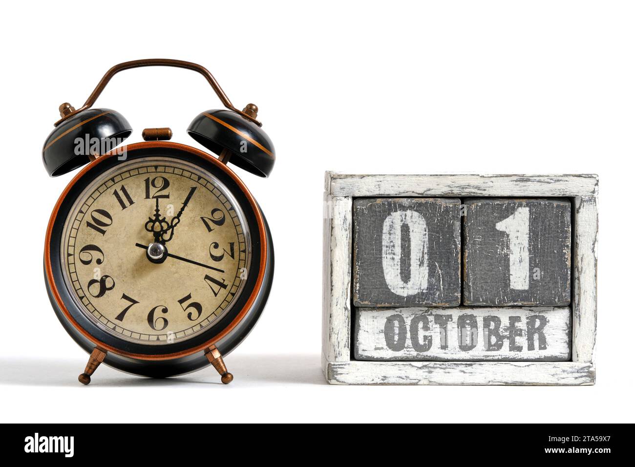 October 01 on wooden calendar with alarm clock white background Stock ...