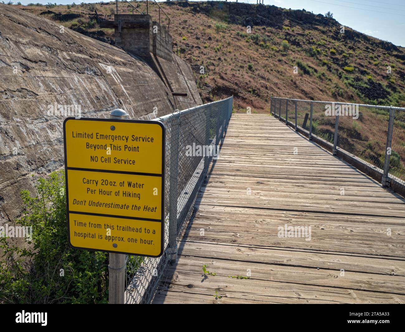 A warning sign for hikers on the trailhead at White River Falls State ...