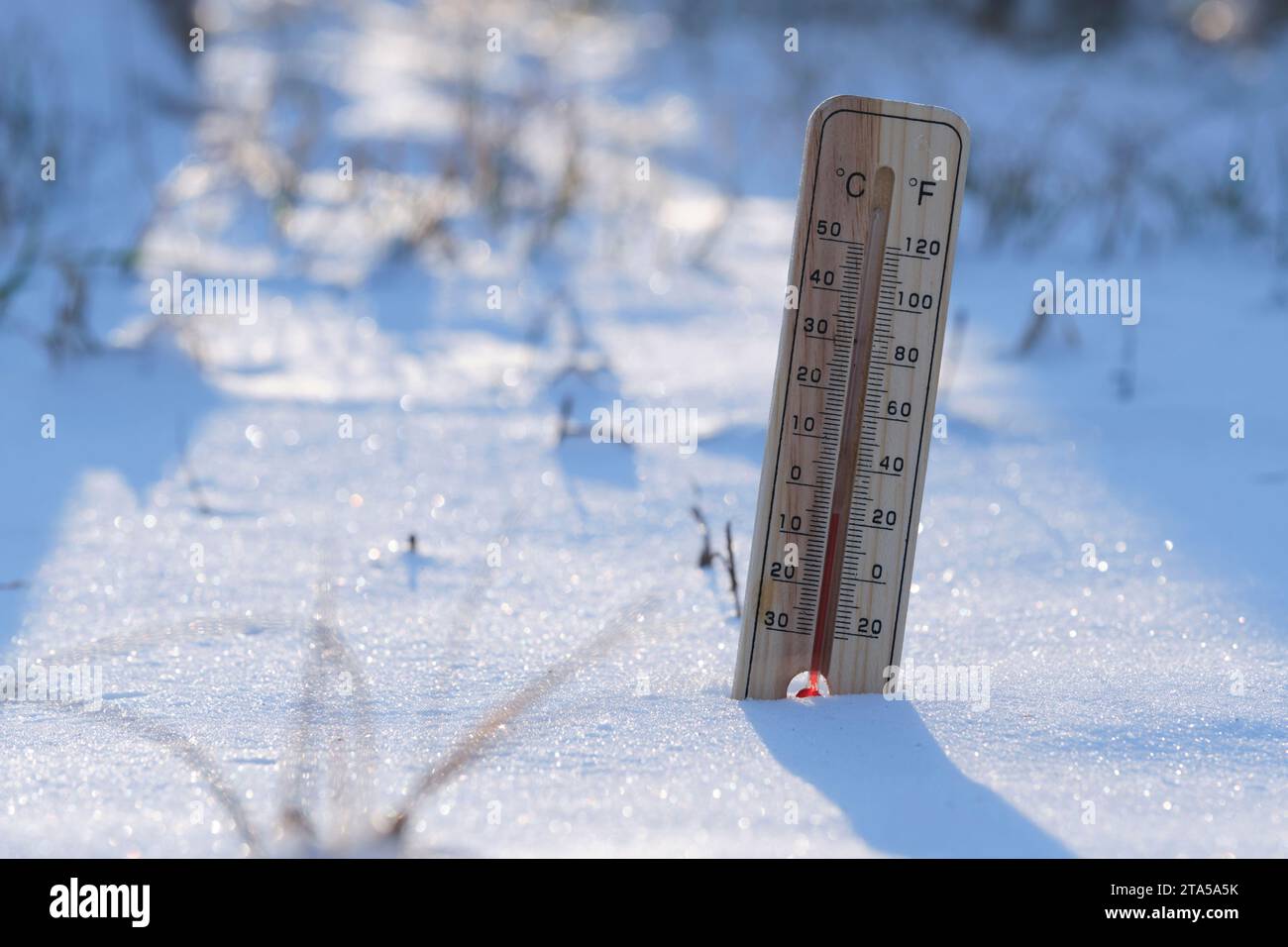 Outdoor thermometer street in snow with low sub zero temperature in ...