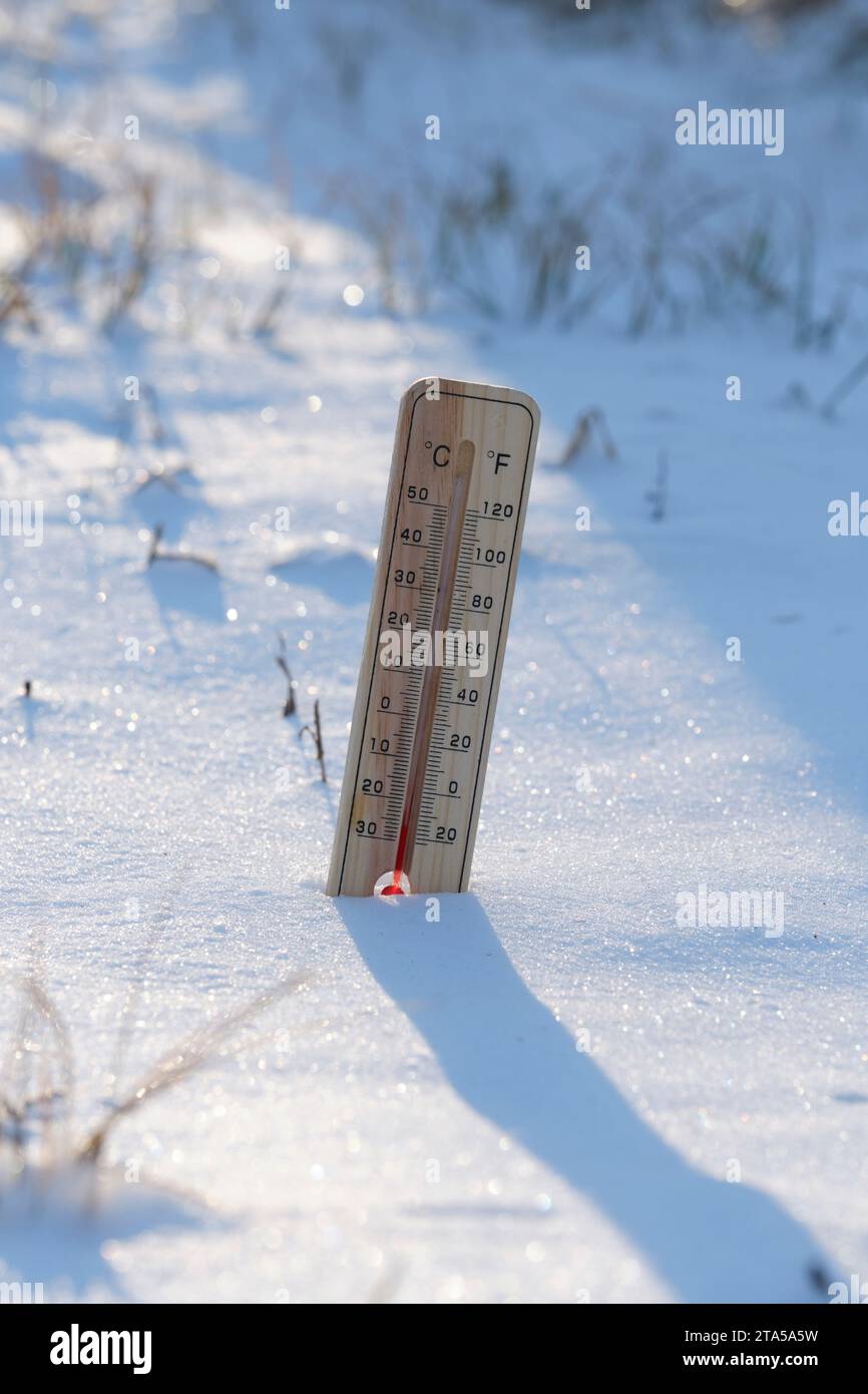 Outdoor thermometer street in snow with low sub zero temperature in ...