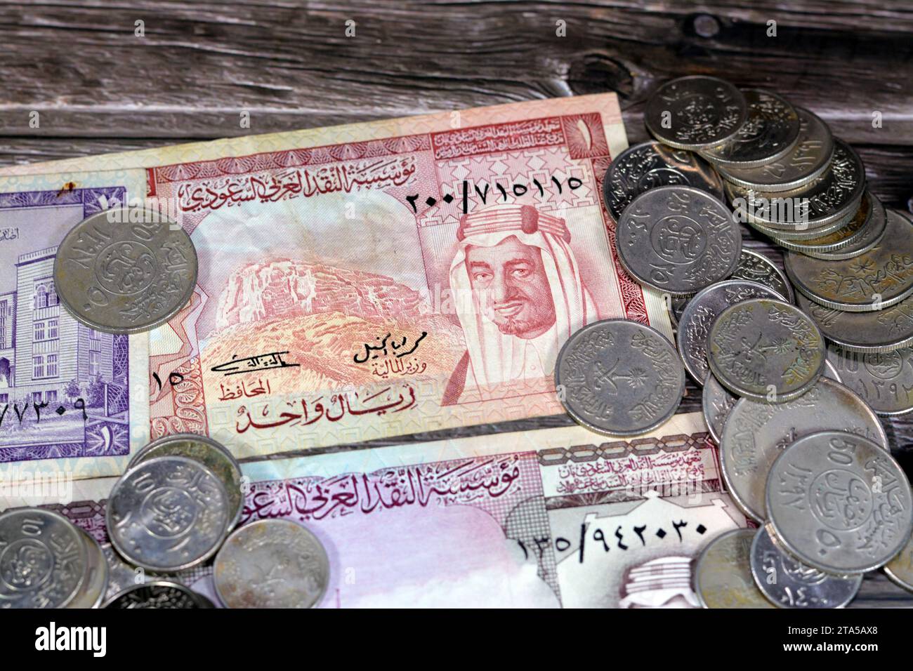 Saudi Arabia riyals money banknote bills and coins of different eras ...