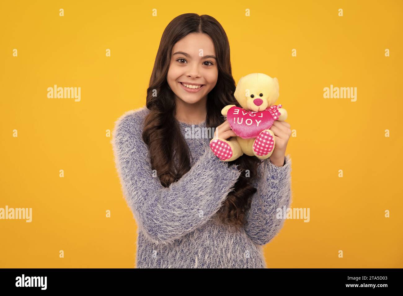 Childhood, toys and kids. Cute teen girl cuddling fluffy toy. Child ...