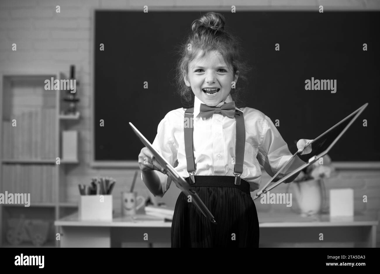 Bad Funny school girl vs distance education. Angry excited kid broken ...