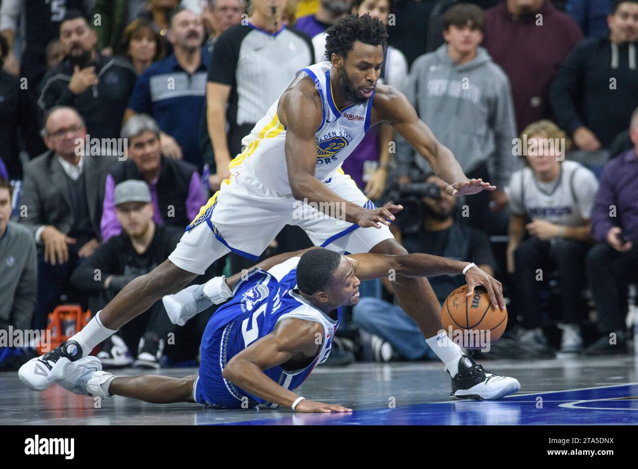 Golden State Warriors forward Andrew Wiggins, top, and Sacramento Kings ...