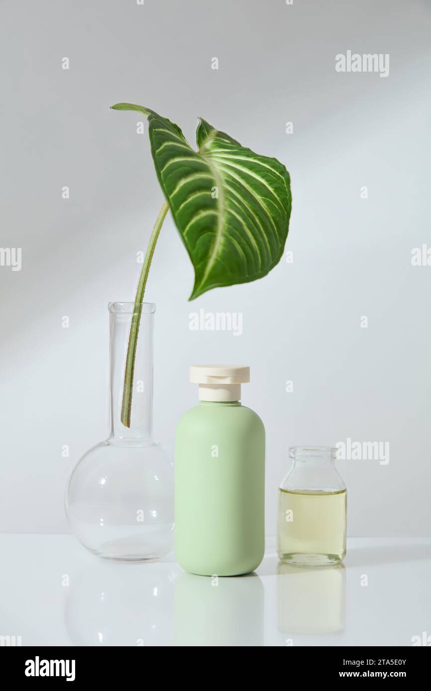 Cosmetic bottle without label displayed with a flat-bottom florence ...