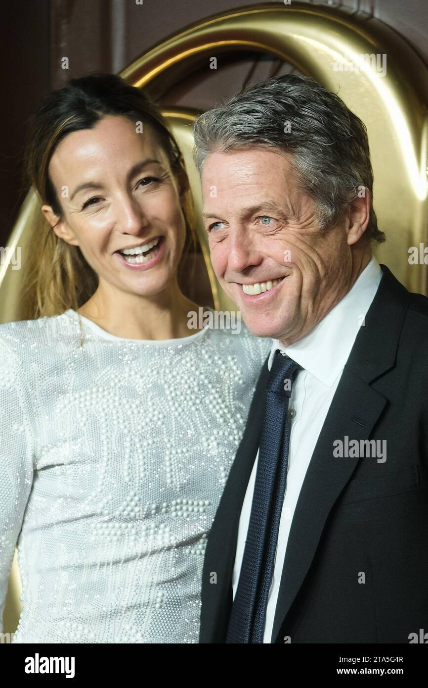 London, UK. Anna Elisabet Eberstein and Hugh Grant photographed ...