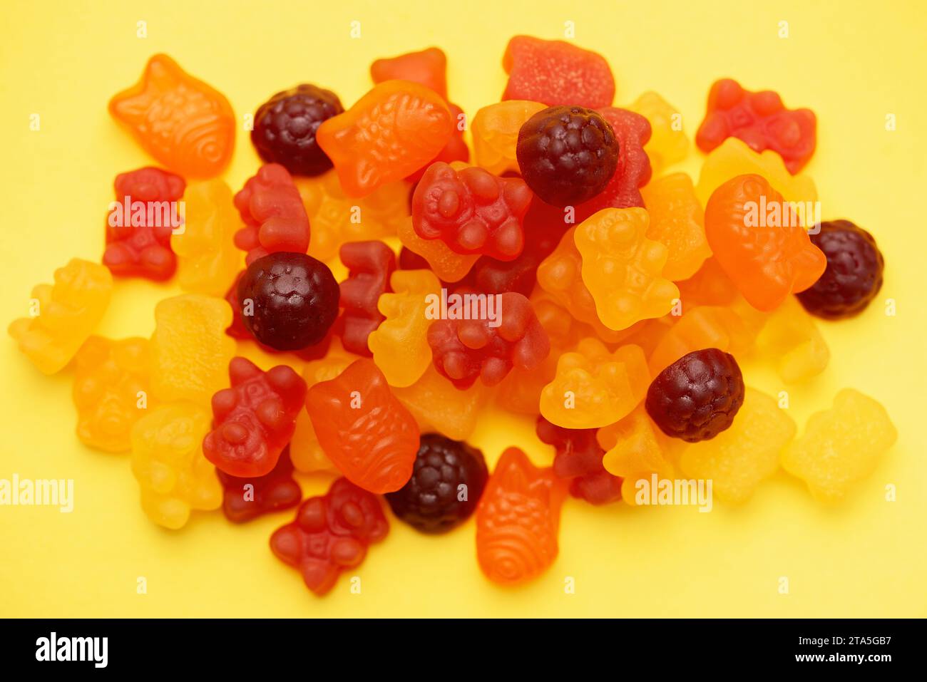 Vitamins for children, jelly gummy candy on yellow background Stock ...