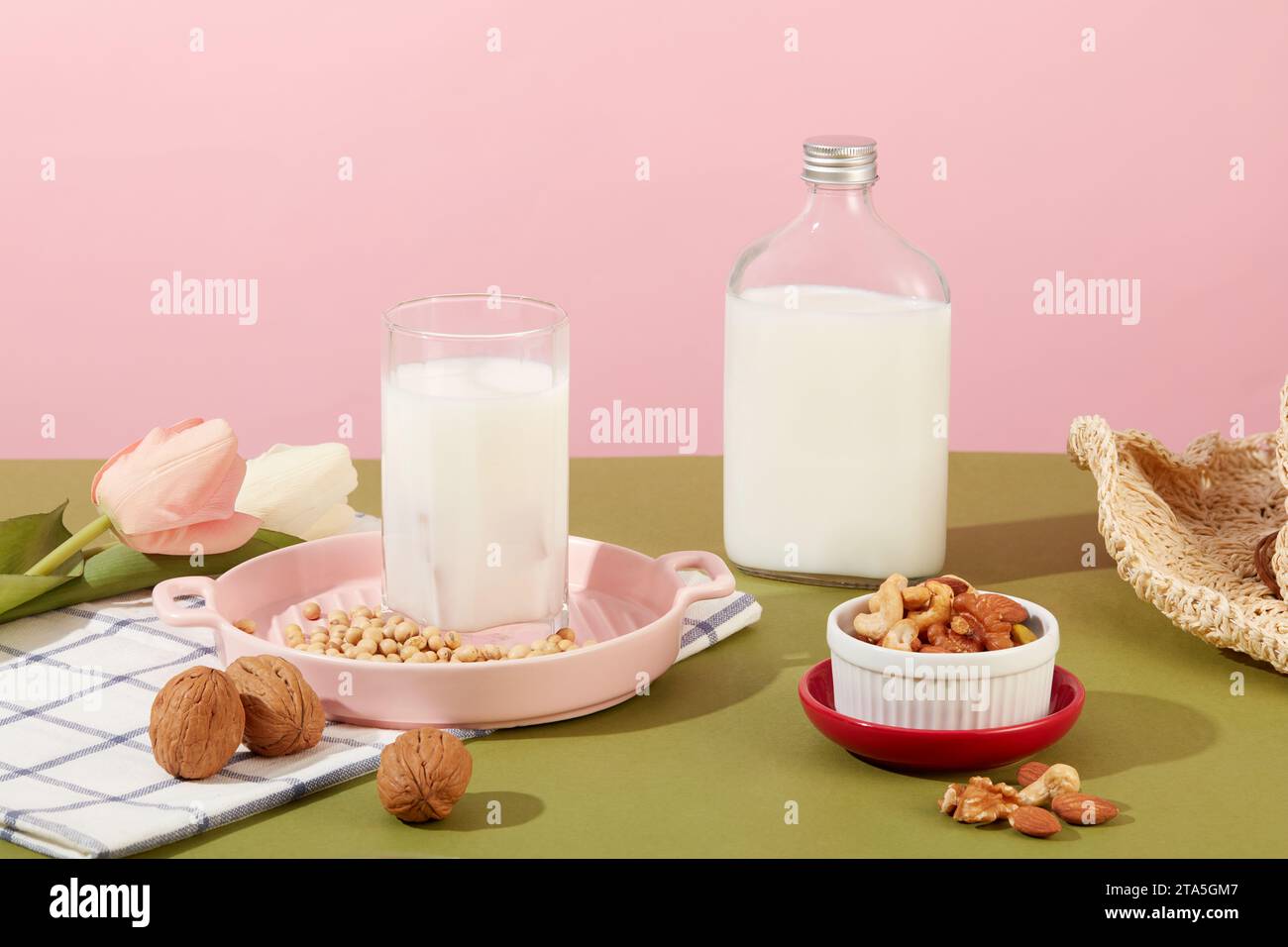 Concept of healthy life with nuts milk inside a cup and unlabeled ...