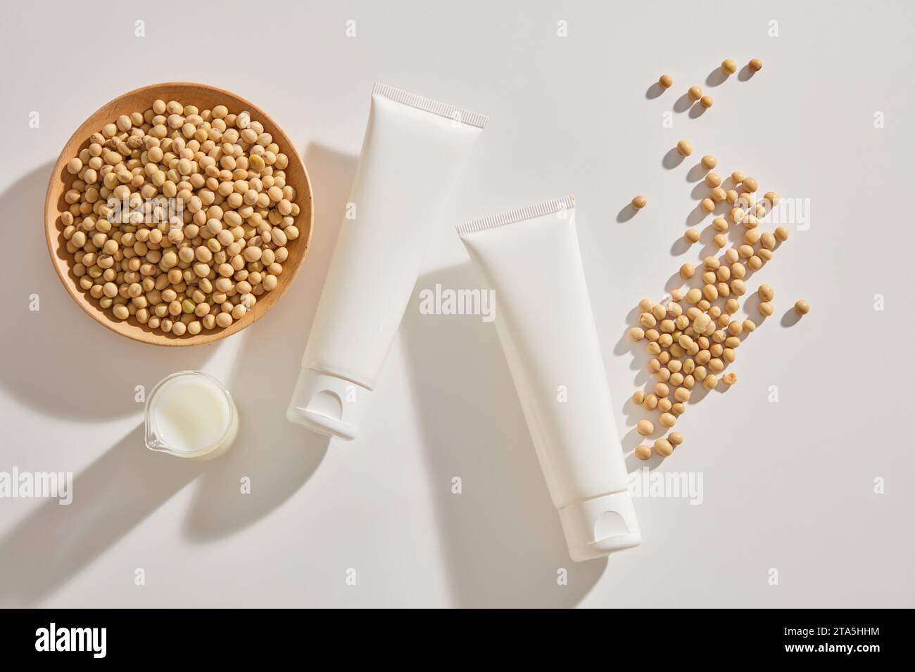 Top view of a beaker of soybean milk arranged with a wooden dish of ...