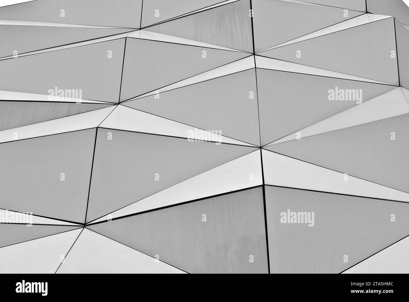 Modern office building with white metallic panel facade and windows ...