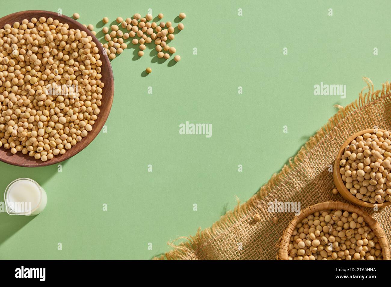 Soybeans seeds are contained inside some wooden and bamboo containers ...