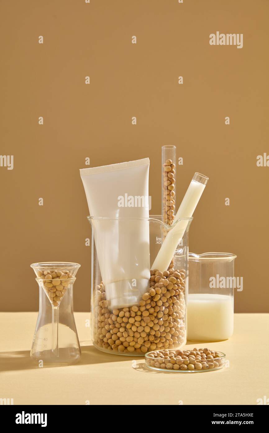 A large beaker containing many soybeans, test tubes and a empty label ...