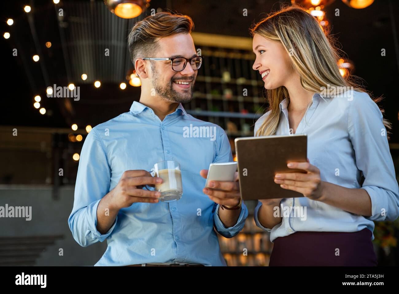 Business colleagues having conversation during coffee break Stock Photo ...