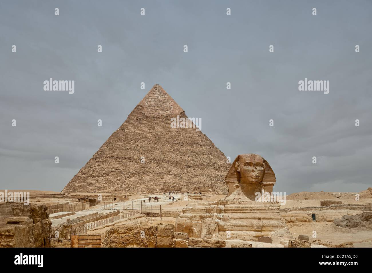 A majestic sphinx sculpture stands guard in front of the iconic ...