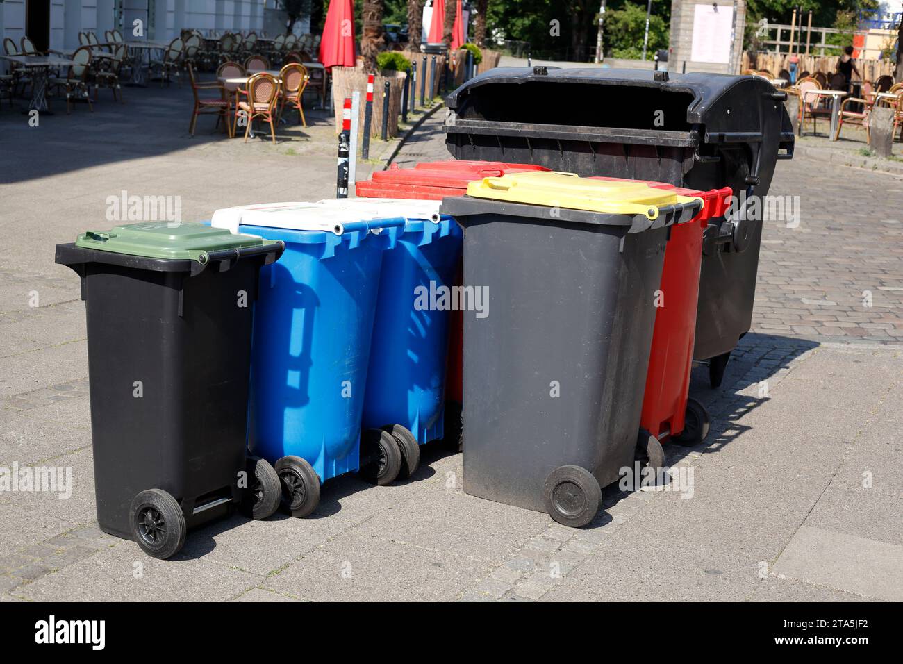 Colorful various recycling garbage cans and garbage cans, standing on ...