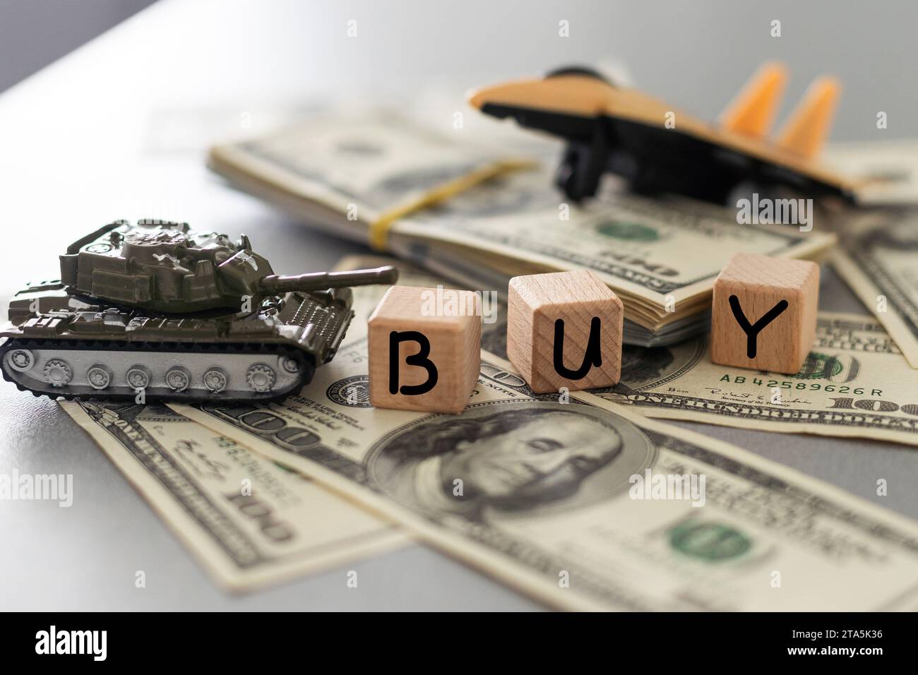 Tank on dollar bills. The concept of war costs, military spending Stock ...