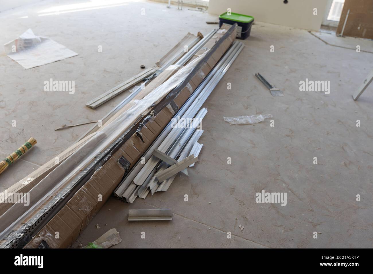Drywall installation work in progress by construction workers at ...