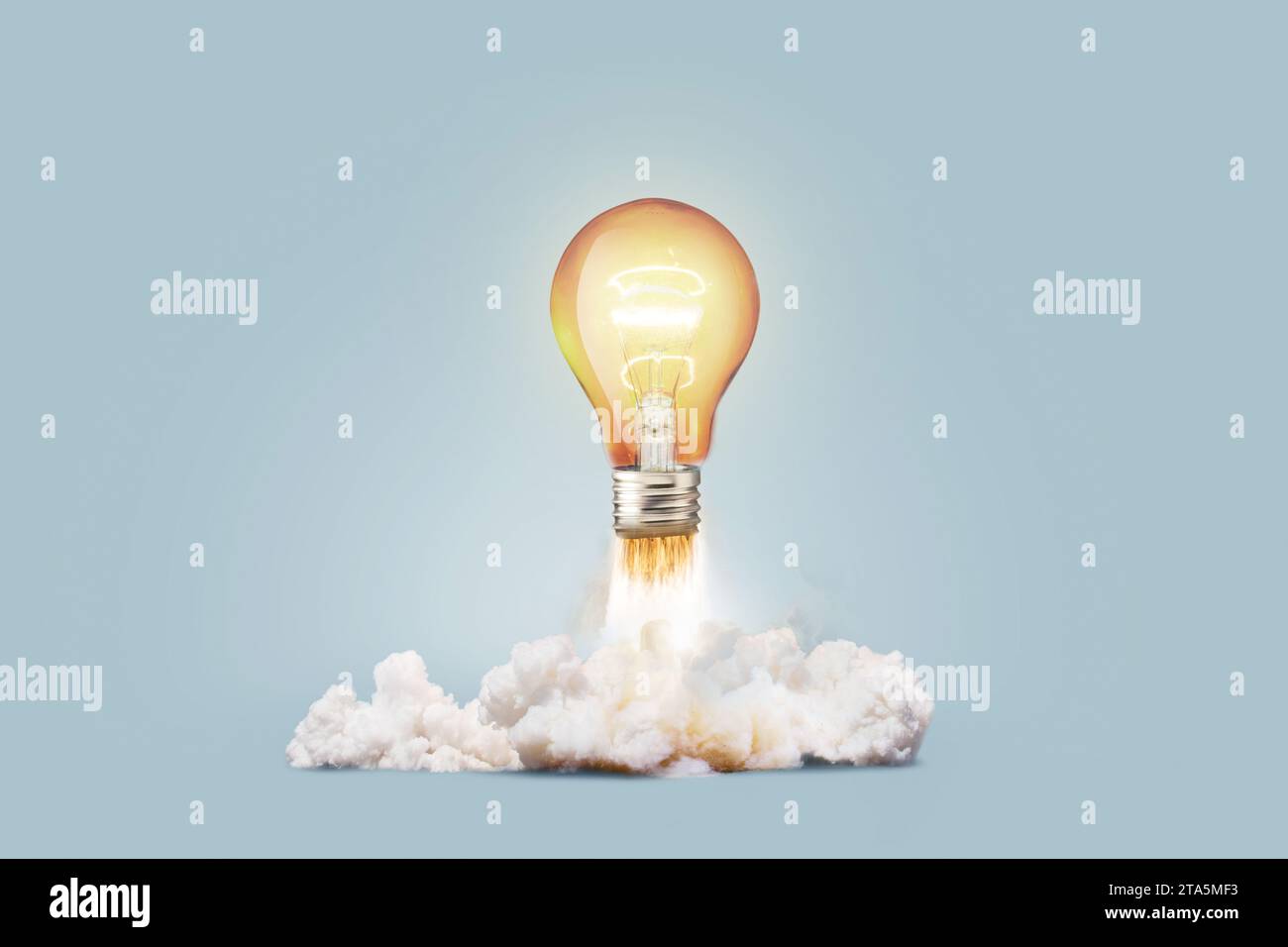 Creative light bulb rocket with blast and smoke takes off on a blue ...