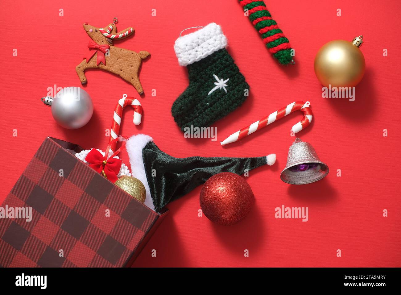 On a red background, cute objects used for Christmas decorations are ...