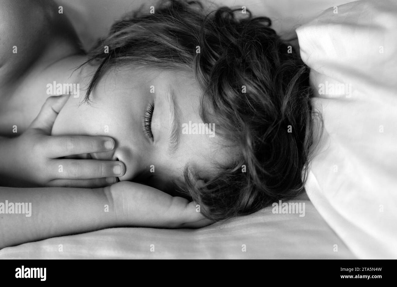 Adorable kids sleeping in bed at home. Healthy peaceful sleep Stock ...