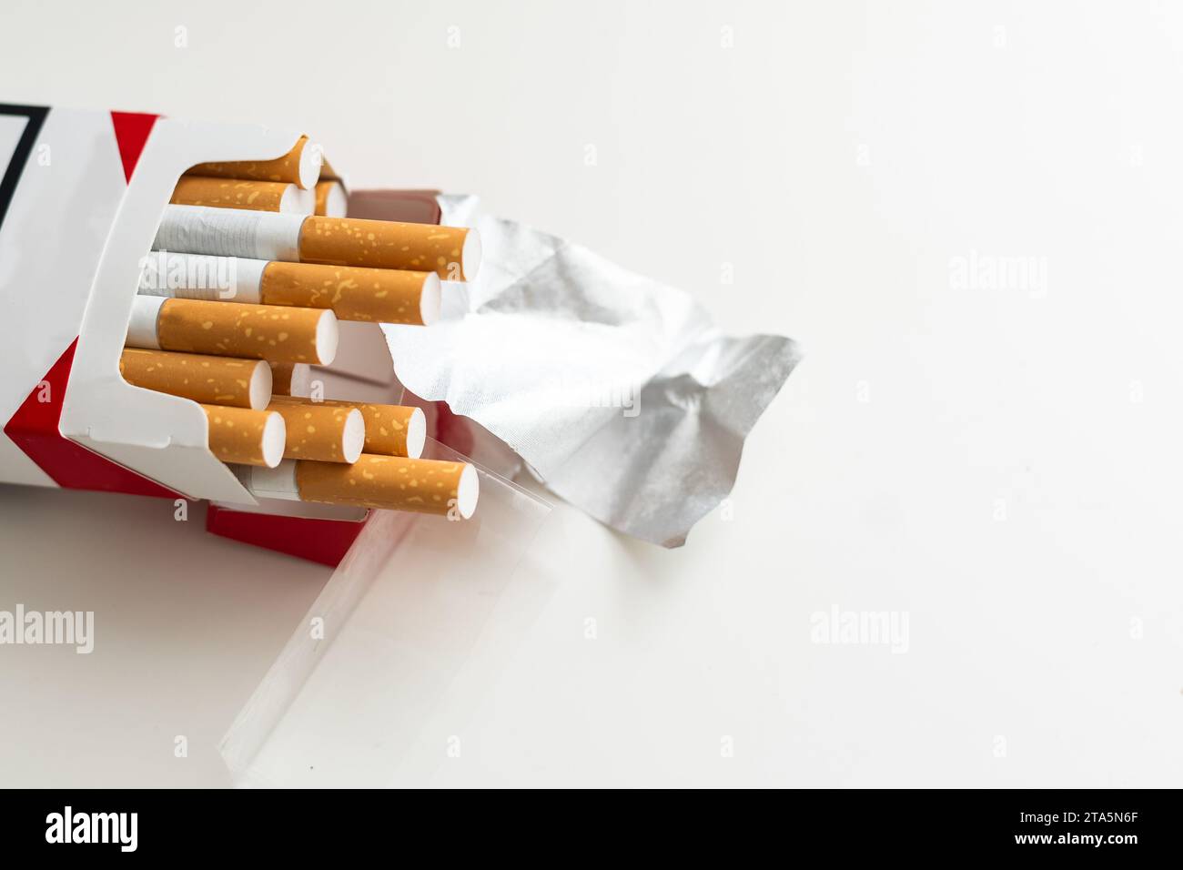 Pack full of filtered cigarettes on white isolated background Stock ...