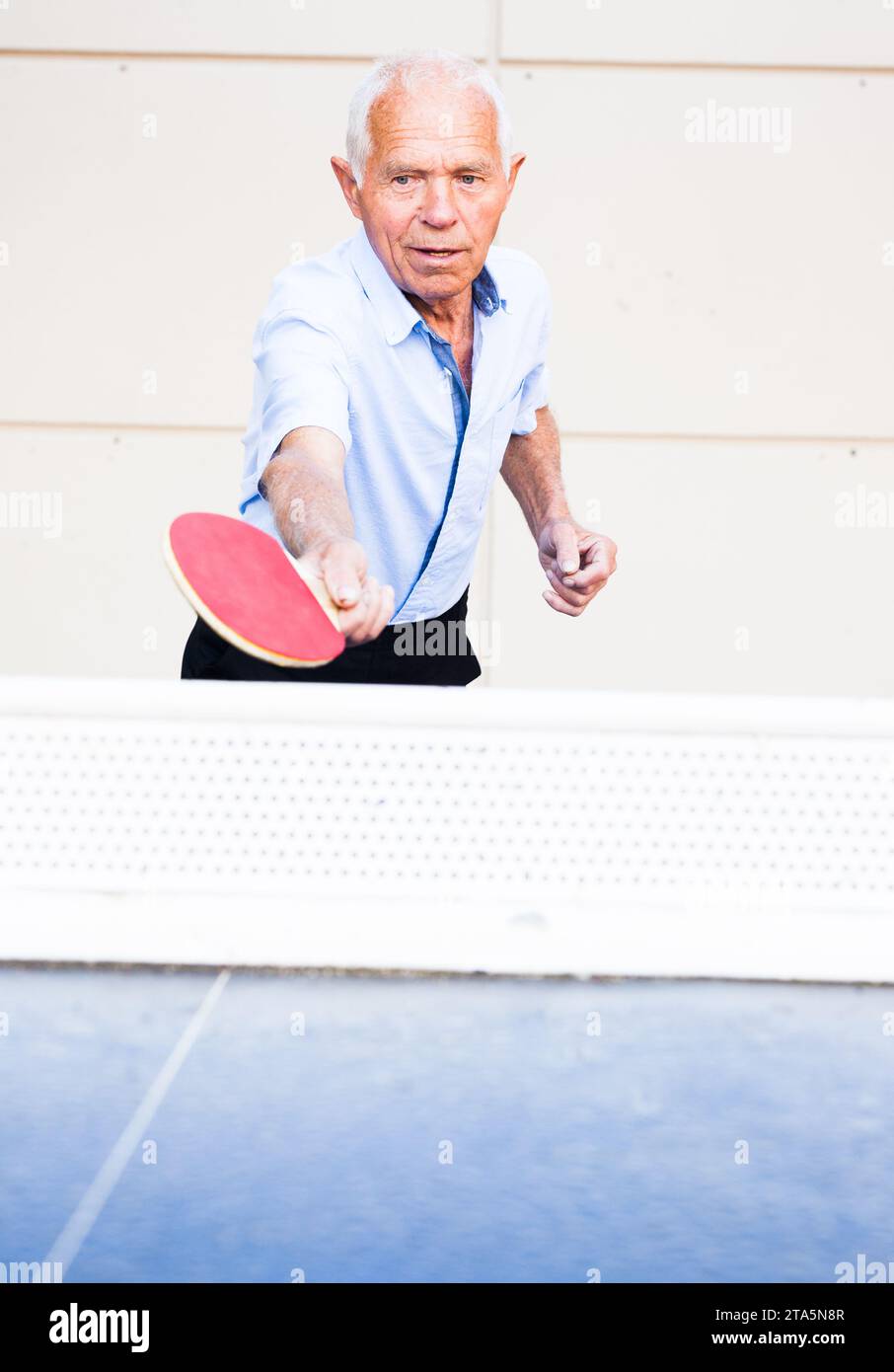 Old couple playing table tennis hi-res stock photography and images - Alamy