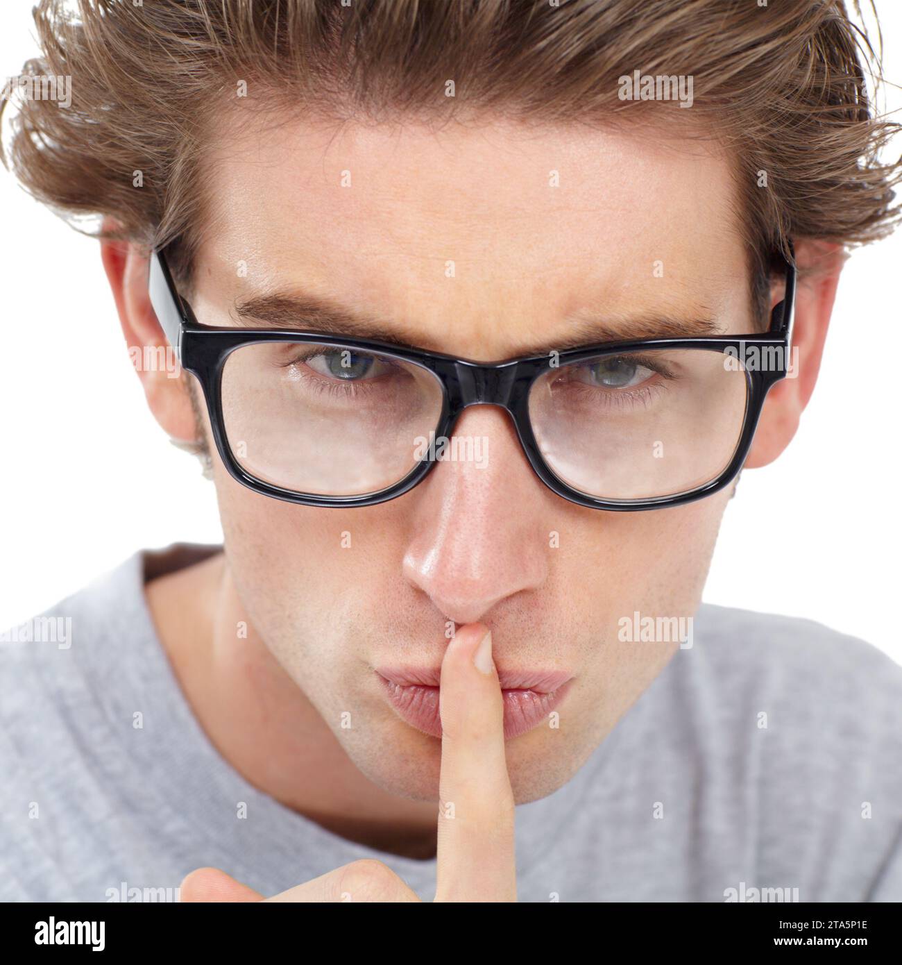 Secret, face and man in studio for sign of privacy, noise and ...