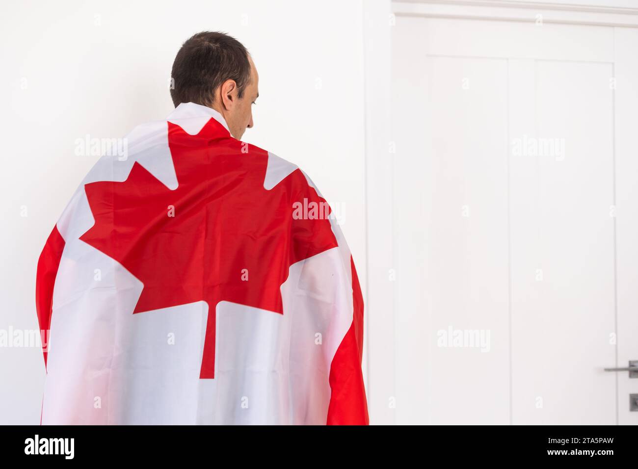Young man with Canadian flag isolated on white Stock Photo - Alamy