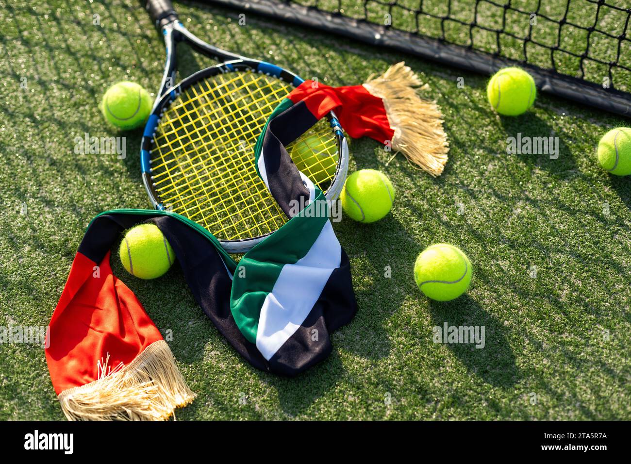 Tennis racket with a set of balls Stock Photo - Alamy